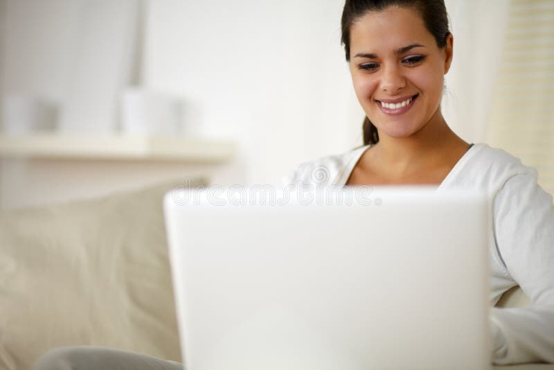 Young Woman Sitting On Couch And Working On Laptop Stock Image Image