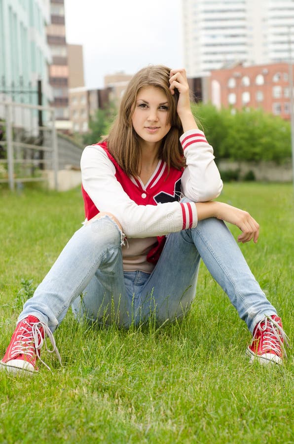 Young Woman Sitting Cross Legged Royalty Free Stock Image - Image: 25609756