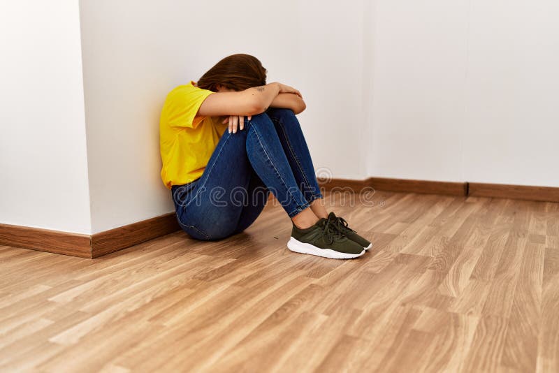 Young Woman Sitting on Floor Crying at Empty Room Stock Photo - Image ...