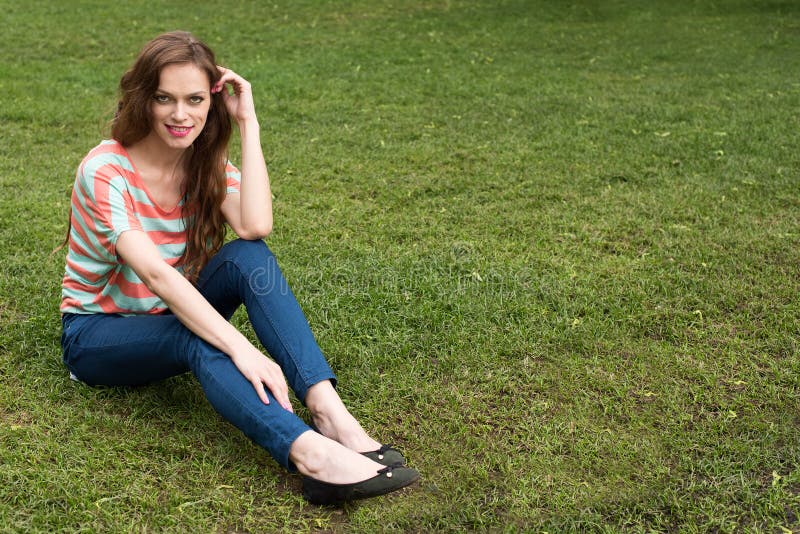 Young Woman Sitting on a Grass Stock Photo - Image of beauty, nature ...