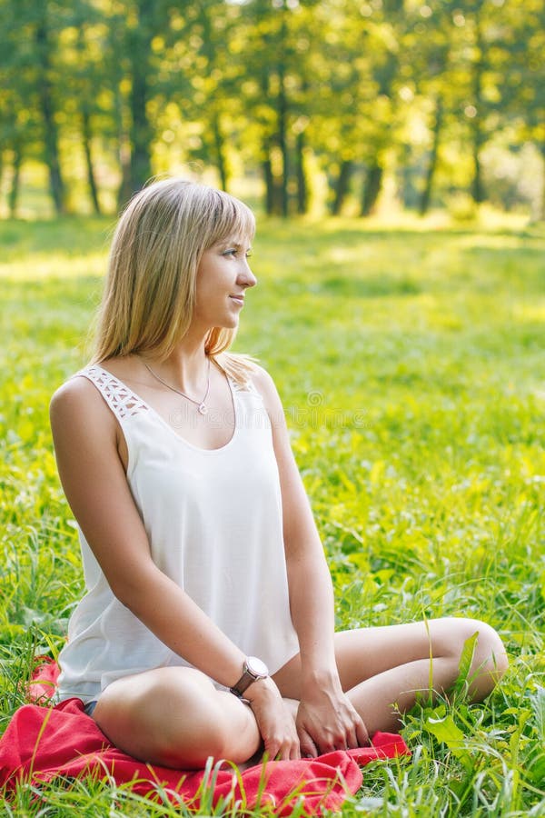 Young Woman Sitting on the Grass Stock Image - Image of body ...