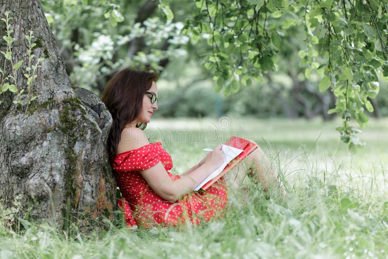 Woman Writing Under Tree Photos - Free & Royalty-Free Stock Photos from ...