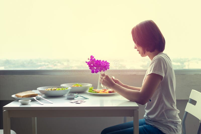 Young Woman Sitting Room Table Eating Dinner Alone Stock Photos - Free ...