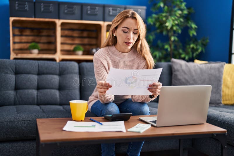 Young Woman Sitting on Sofa Accounting at Home Stock Image - Image of ...