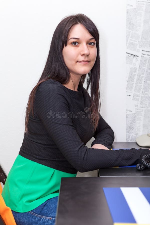 Young Woman Sitting at Table Stock Photo - Image of beauty, female ...