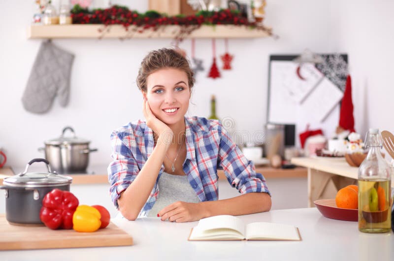 Young Woman Sitting a Table in the Kitchen Stock Photo - Image of ...
