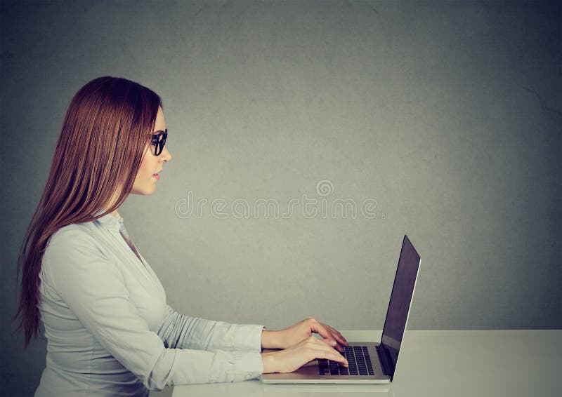 Young Woman Sitting at Table Using Working on Laptop Computer Stock ...