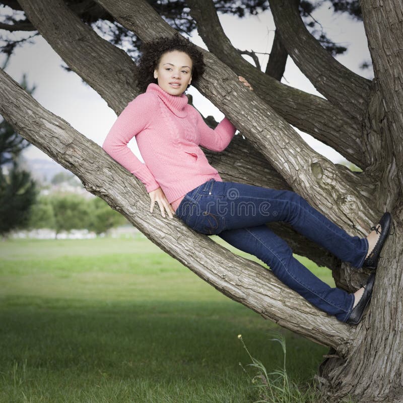Young Woman Sitting in Tree Stock Image - Image of leisure, outside ...