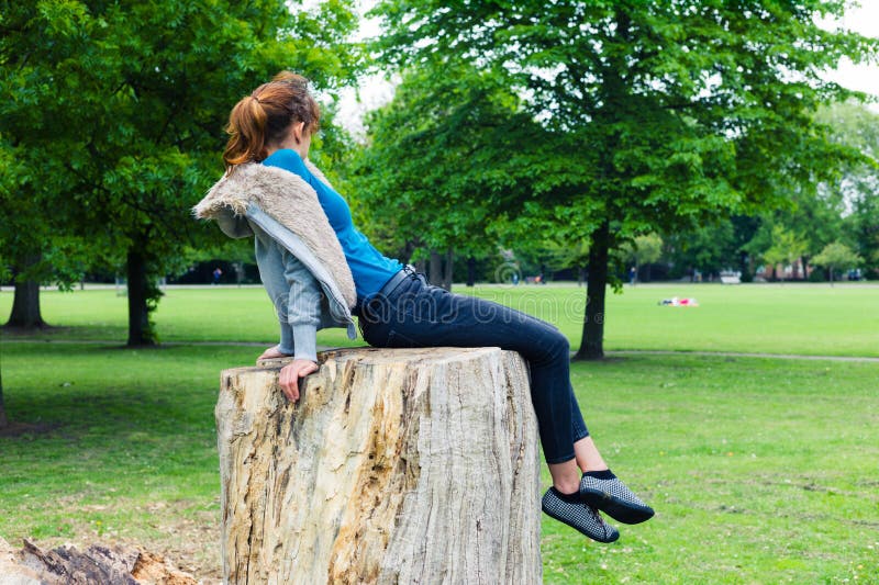 Sitting in tree stock image. Image of legs, casual, dangling - 31164231