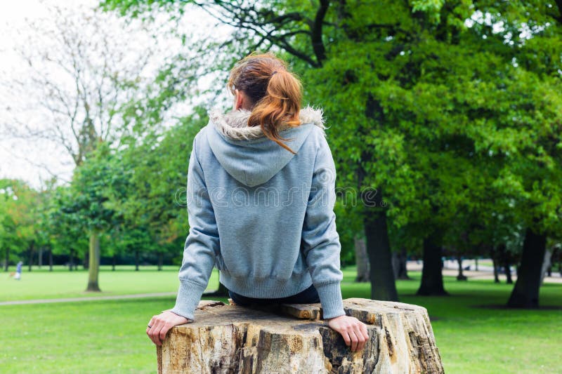 Sitting in tree stock image. Image of legs, casual, dangling - 31164231