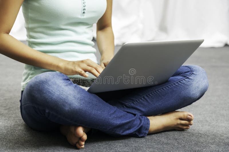 Young Woman Sitting while Using Laptop Stock Photo - Image of sitting ...