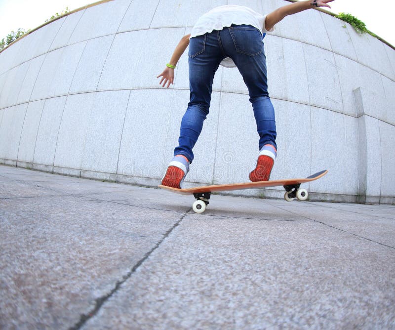 Young Woman Skateboard Practice Stock Photo - Image of orange, modern ...