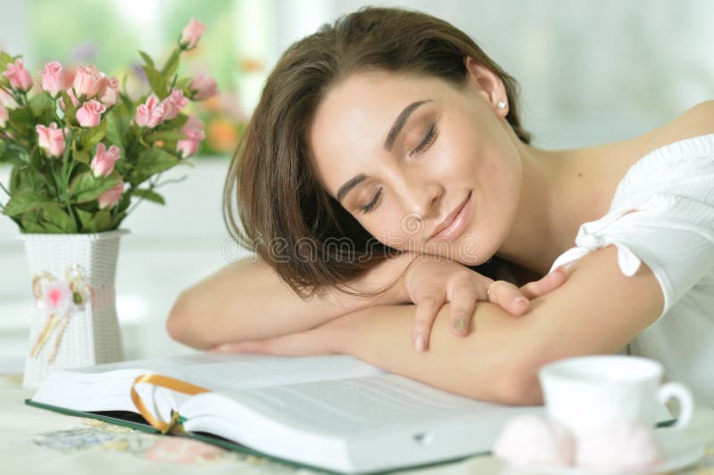 Young Woman Sleeping on Book Stock Image - Image of european, dress ...
