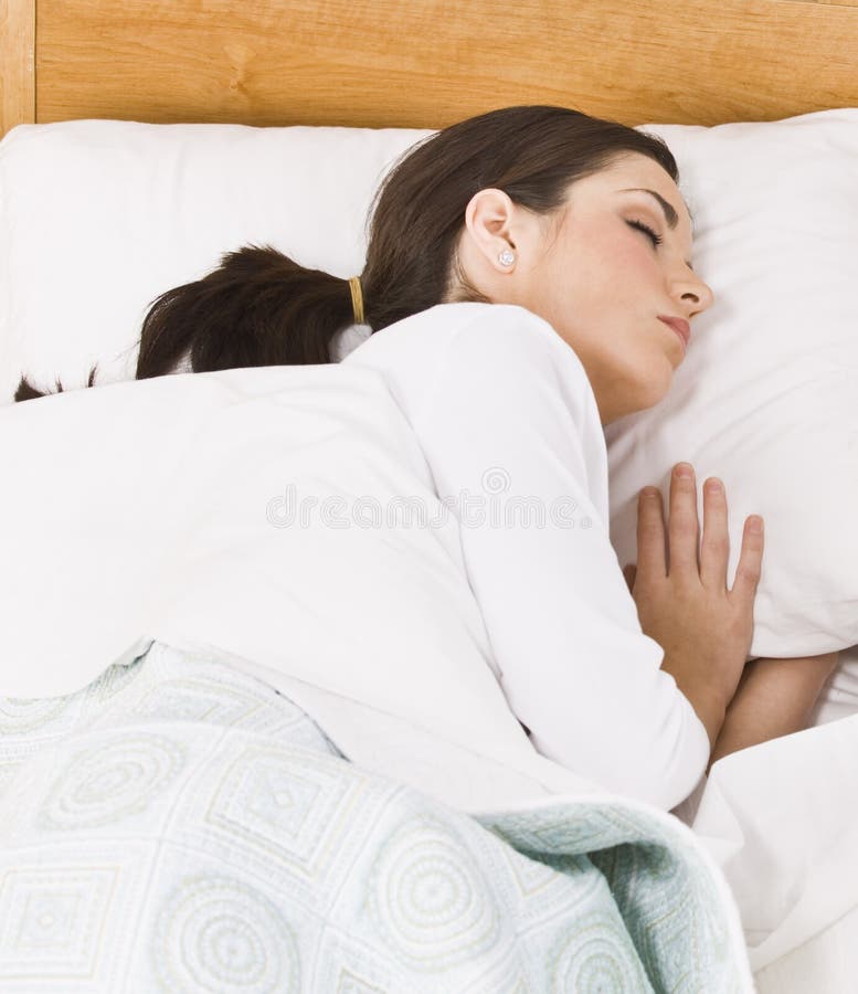 Young Woman Sleeping on Her Side Stock Photo - Image of clothing ...