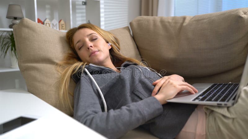 Young Woman Sleeping with Laptop on the Sofa at Home Stock Video ...