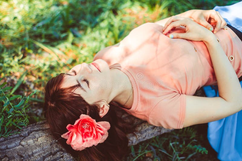 Girl sleeping in nature stock image. Image of flower - 116109855