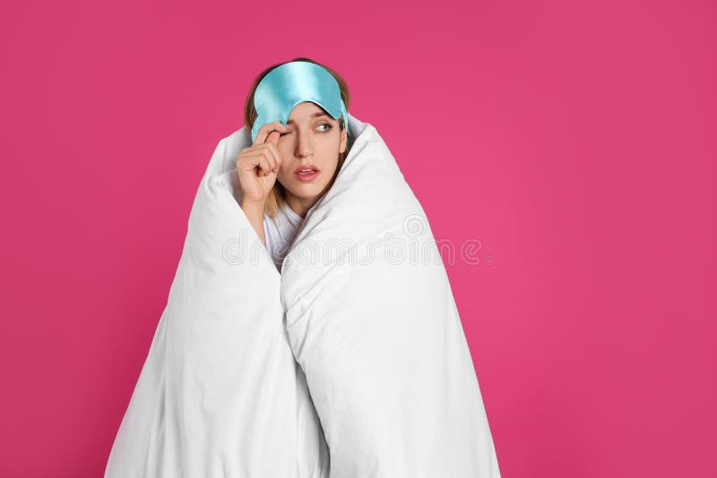 Young Woman in Sleeping Mask Wrapped with Soft Blanket on Pink ...
