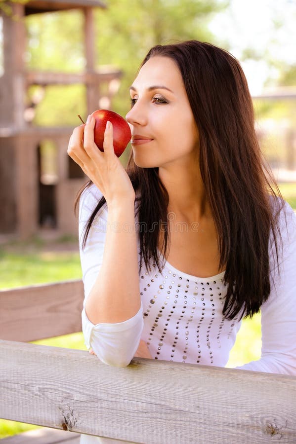 Young woman smell apple stock photo. Image of foods, female - 14505392