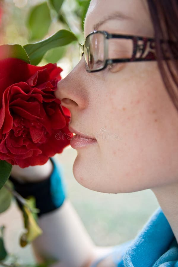 Smelling red roses stock image. Image of profile, roses - 1412041