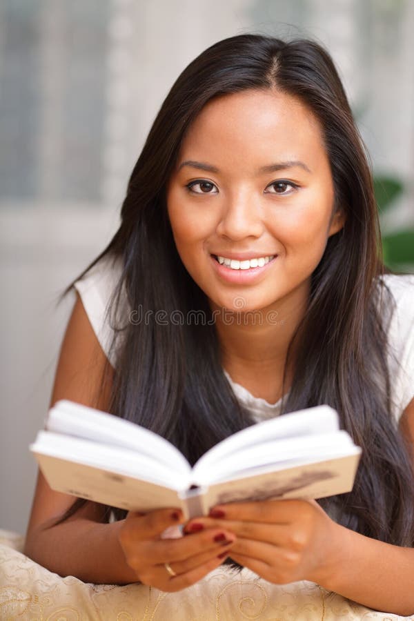 Young Woman Smiling with a Book Stock Image - Image of isolated, modern ...