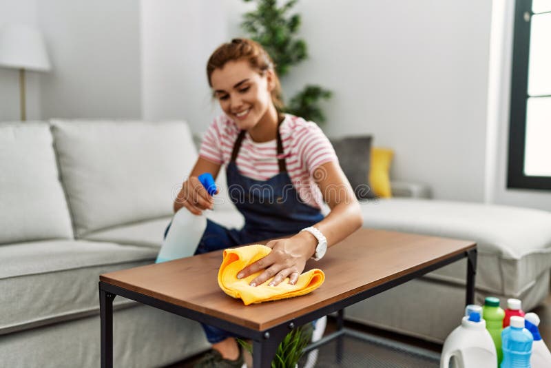 Young Woman Smiling Confident Cleaning Table at Home Stock Image ...