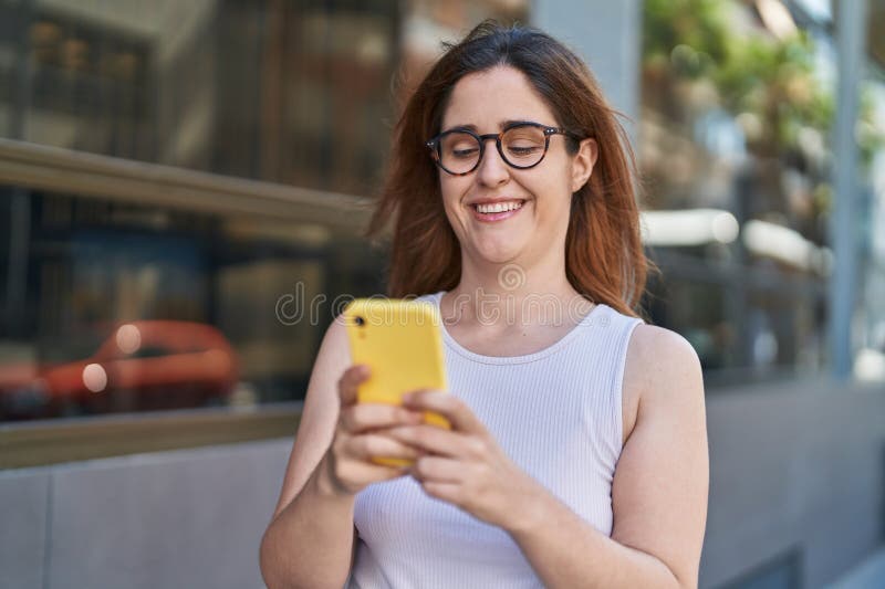 Young Woman Smiling Confident Using Smartphone at Street Stock Photo ...