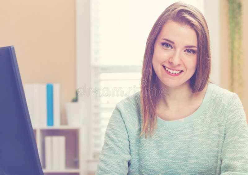 Young Woman Smiling in Her Home Office Stock Photo - Image of modern ...
