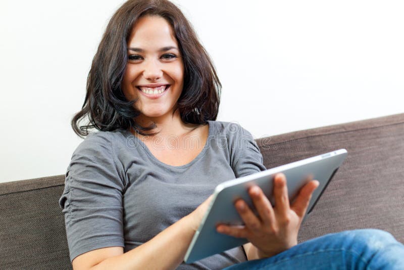 Young Woman Smiling while Using Touchpad Stock Photo - Image of person ...