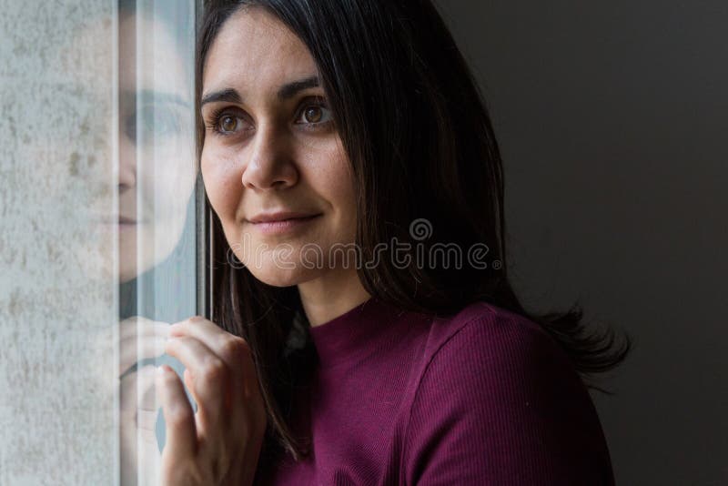 Young Woman Smiling by the Window Stock Image - Image of casual, girl ...