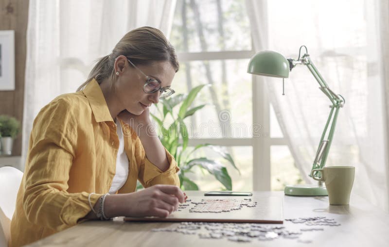 Young Woman Solving a Puzzle at Home Stock Image - Image of girl, game ...