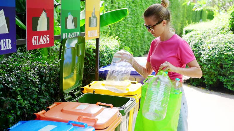 Young Woman Sorting Garbage in the Yard of the House Stock Footage ...