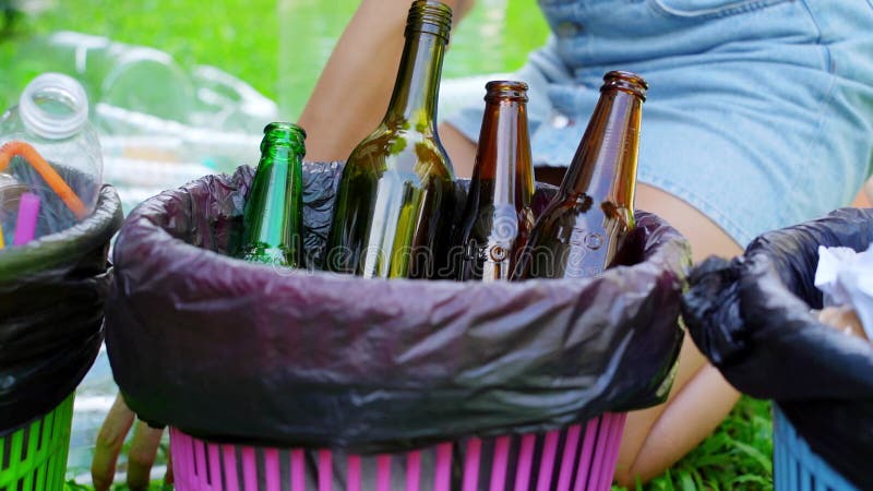 Young Woman Sorting Glass Trash in the Yard of the House Stock Footage ...
