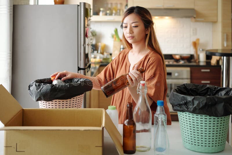 Young woman sorting waste stock image. Image of responsible - 218909913