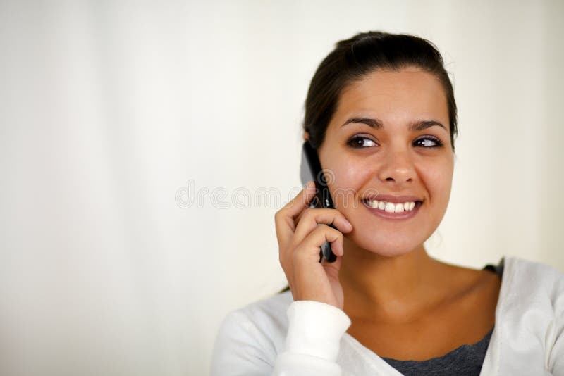 Young Woman Speaking on Cellphone Looking Right Stock Image - Image of ...