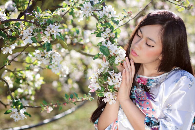 Young Woman with Spring Flowers Stock Image - Image of chinese, summer ...