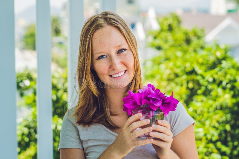 Young Woman with Spring Purple Flowers. Spring Concept Stock Photo ...