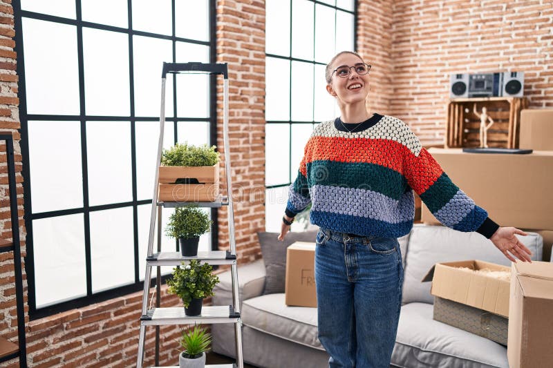 Young Woman Standing with Arms Open at New Home Stock Photo - Image of ...