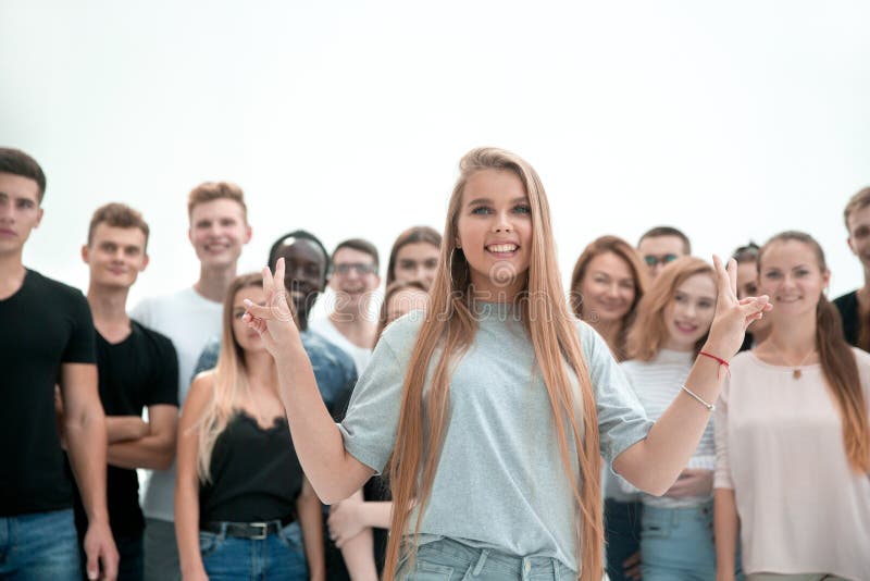 Young Woman Standing in Front of a Casual Group of Young People Stock ...