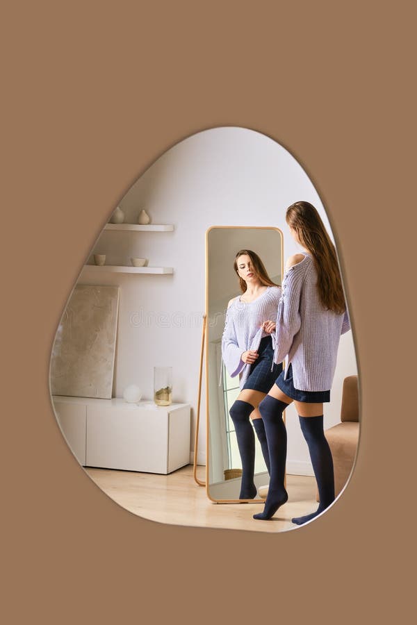 Young Woman Standing in Front of the Mirror Stock Image - Image of ...