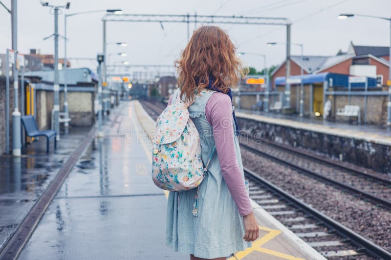 Young Woman Standing on Platform Stock Photo - Image of cloudy, dark ...