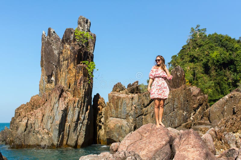 Young Woman Standing among the Rocks. Walking. Stock Image - Image of ...