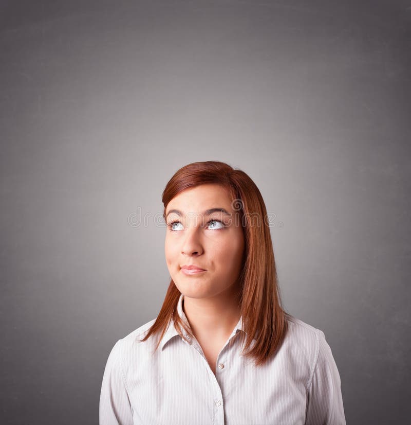 Young Woman Standing and Thinking with Copy Space Stock Photo - Image ...
