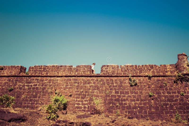 Young Woman Stands on the Brick Wall of the Old Fort Stock Photo ...