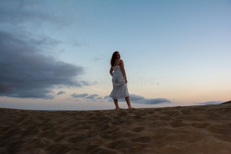 Young Woman Stands with Her Back on a Sand Dune Stock Image - Image of ...