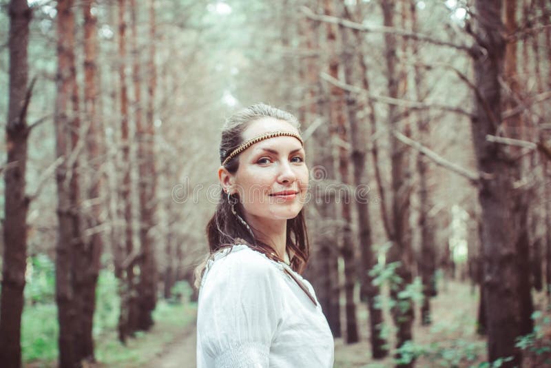 A Woman is Standing between Trees Stock Image - Image of rural, rocky ...
