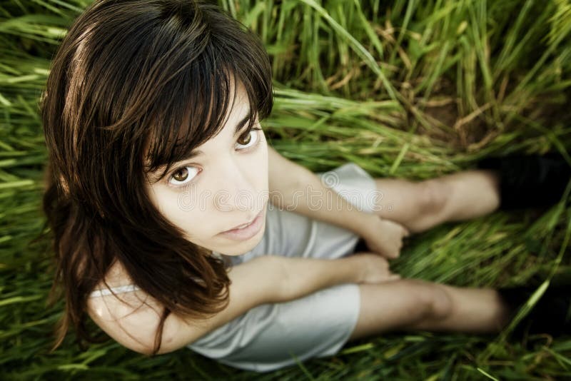 Young Woman Staring at Camera Stock Photo - Image of staring, serene ...