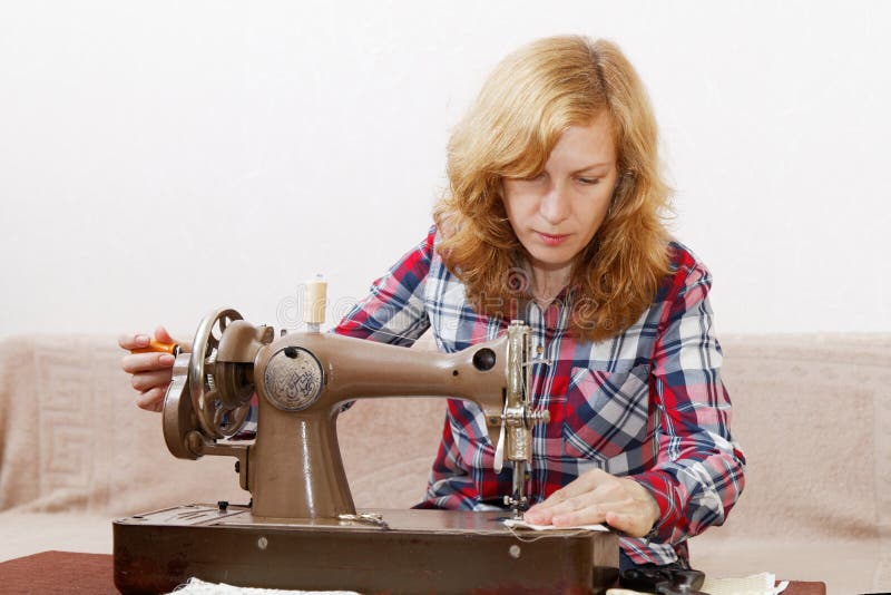 Young Woman Stitching Fabric Using a Sewing Machine Stock Image - Image ...