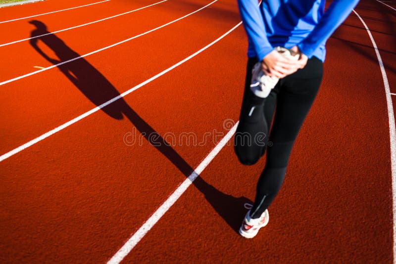 Young Woman Stretching before Her Run Casts Stock Photo - Image of ...