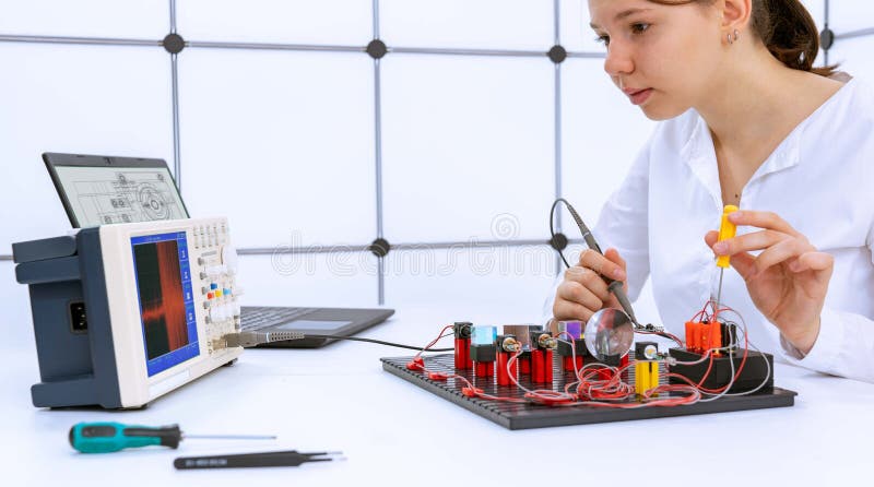 Young Woman Student is Experimenting with a Laser Measurement System ...