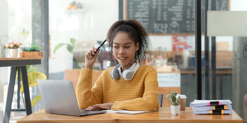Young Woman Student Using Computer and Mobile Device Studying Online ...